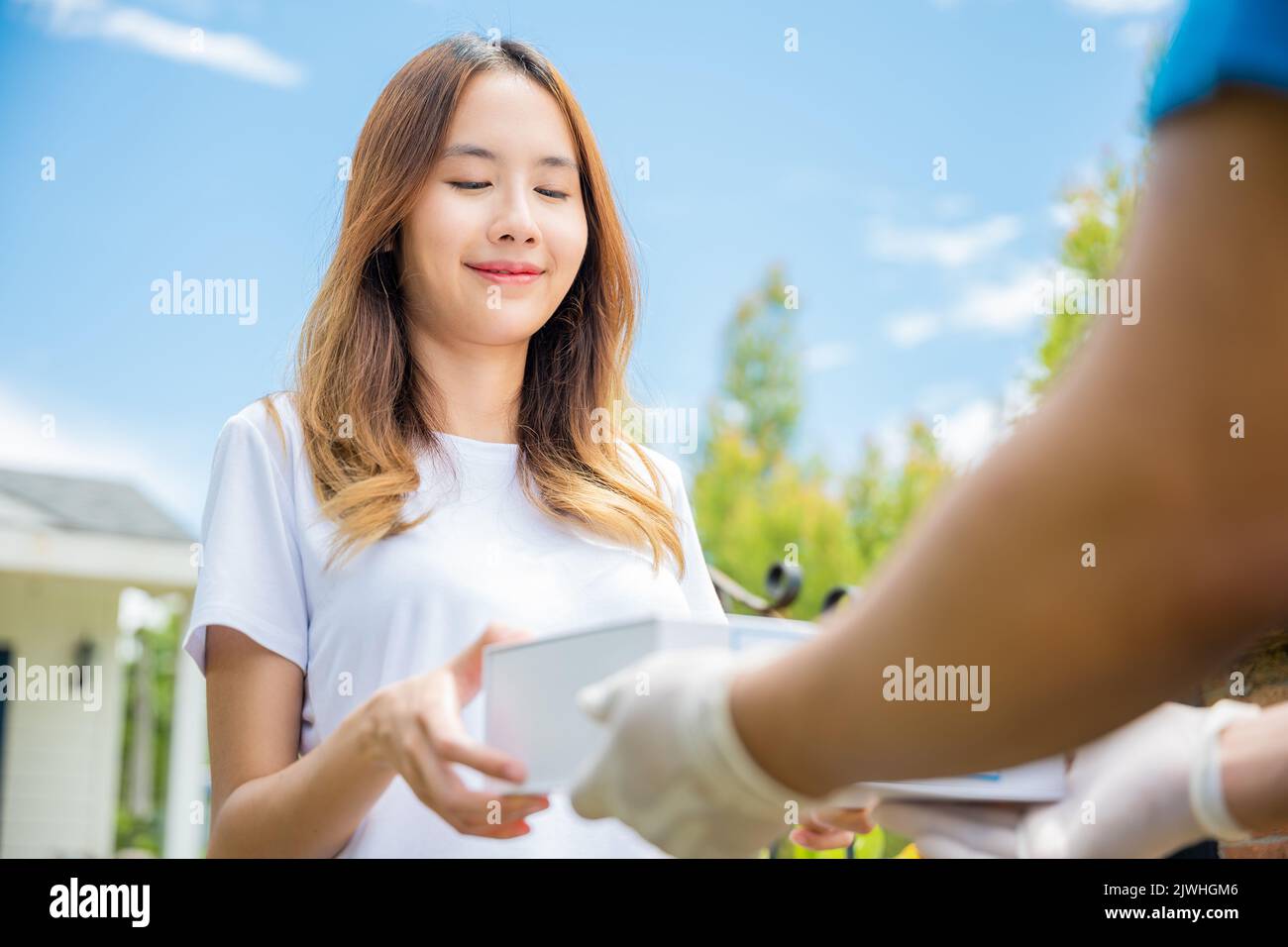 Sick Asian young woman receive medicine first aid pharmacy box from ...