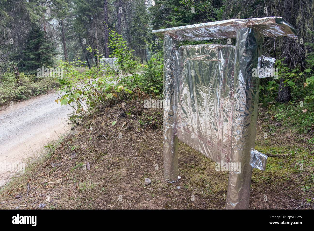 Foil wrapped signs protected against wildfire, Selway river, Idaho ... Foil wrapped signs protected against wildfire, Selway river, Idaho ...