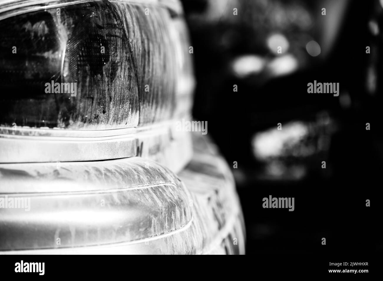 Layer of dust coving the taillight of a car after driving down a gravel ...