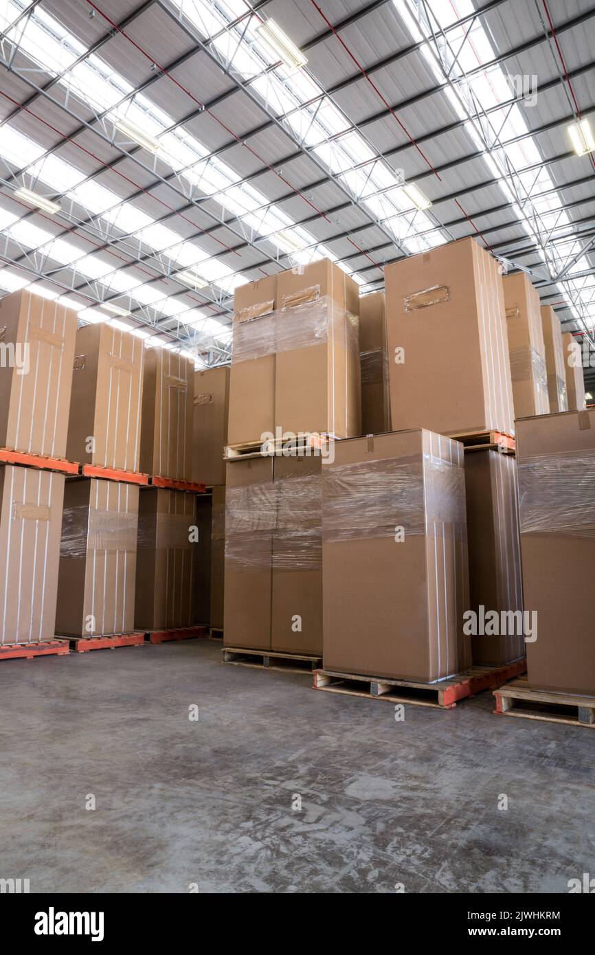 Cardboard box arranged in warehouse Stock Photo - Alamy