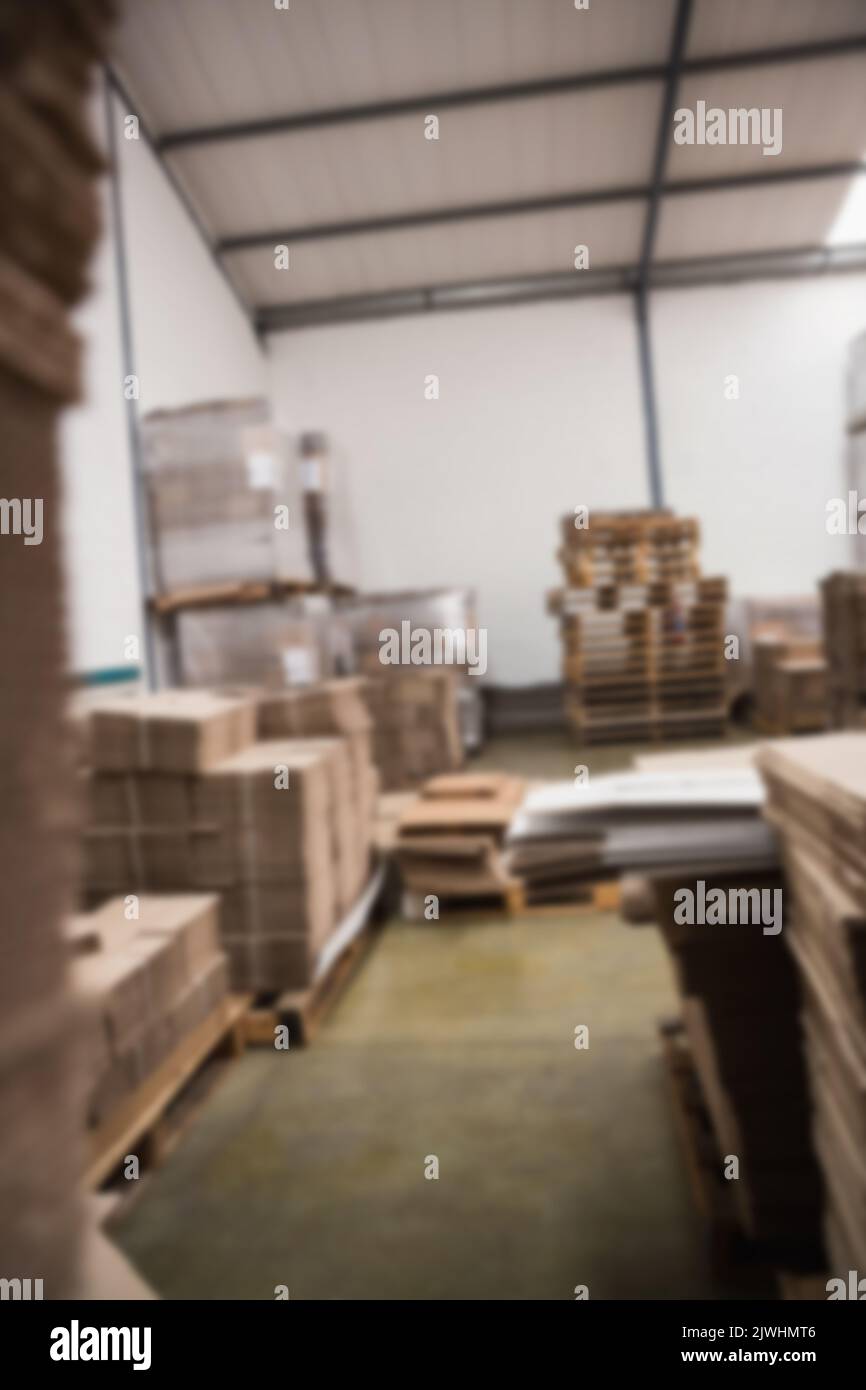 Stack of cardboard boxes in storage room Stock Photo - Alamy
