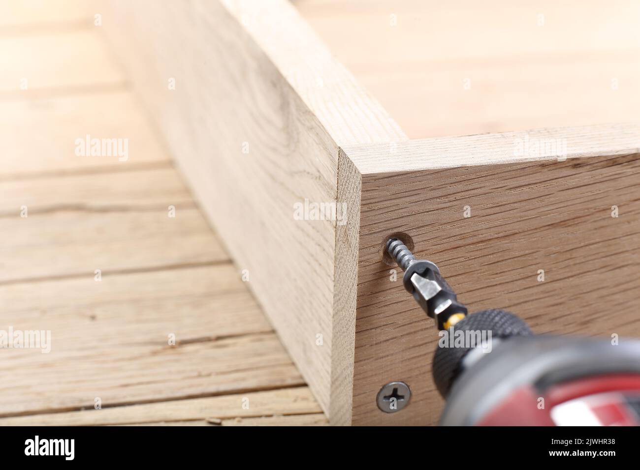 Driving screws into a wooden frame with an Driving screws into a wooden ...