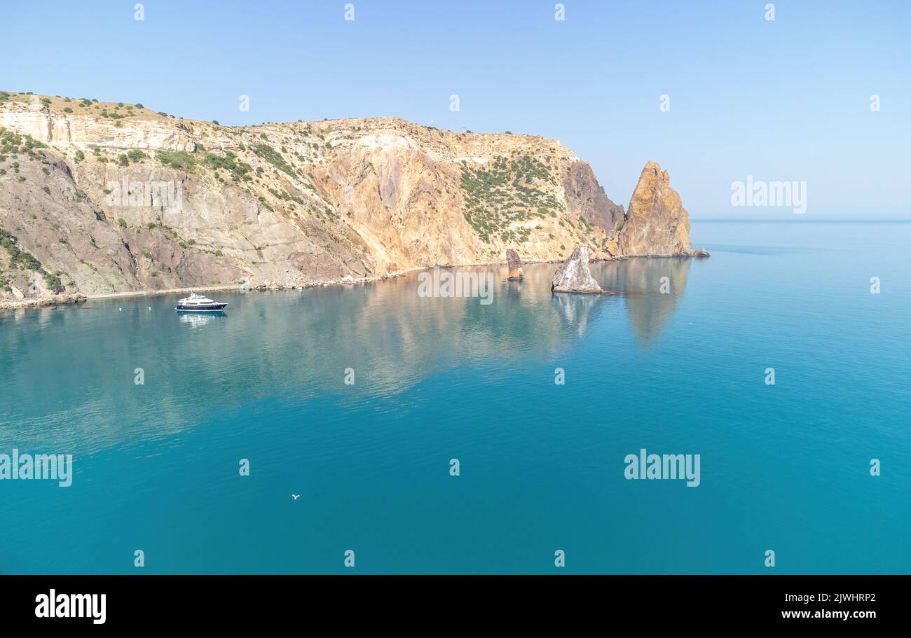 Aerial yacht on calm sea. Luxury cruise trip. View from above of white ...