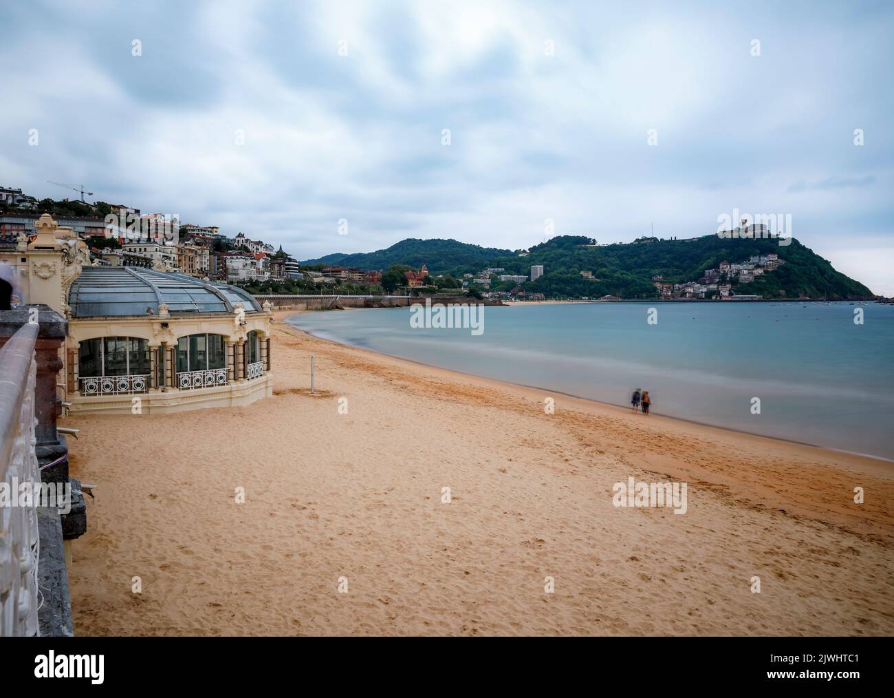 Panorama of La Concha bay, people walking on the beach in San Sebastian ...