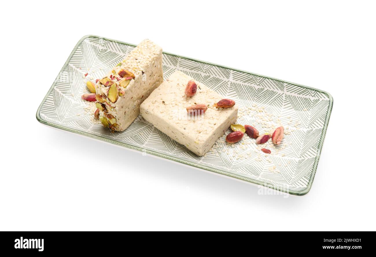 Plate of tasty sesame halva with pistachios on white background Stock Photo - Alamy
