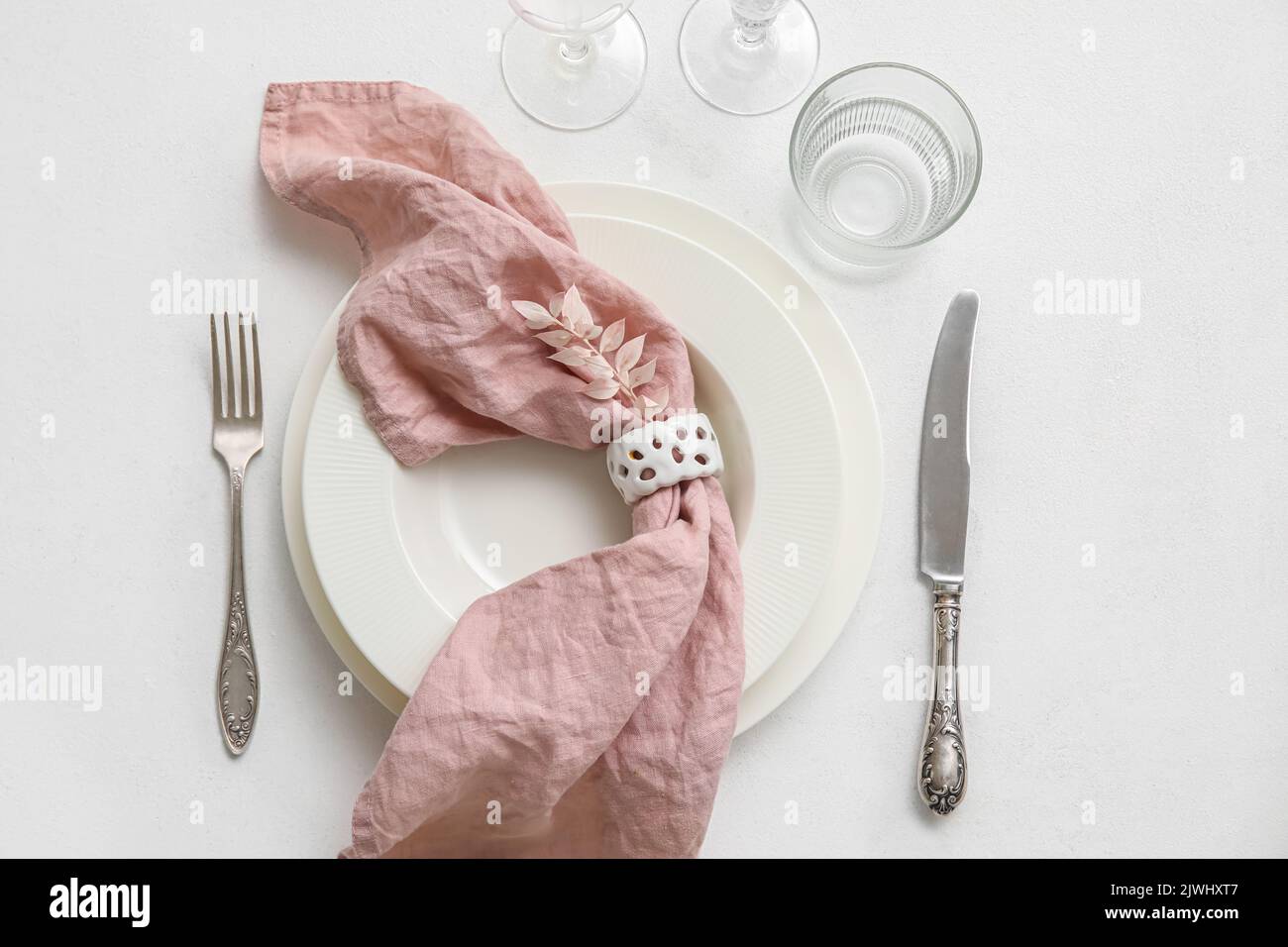 Simple table setting with decor on white background Stock Photo - Alamy