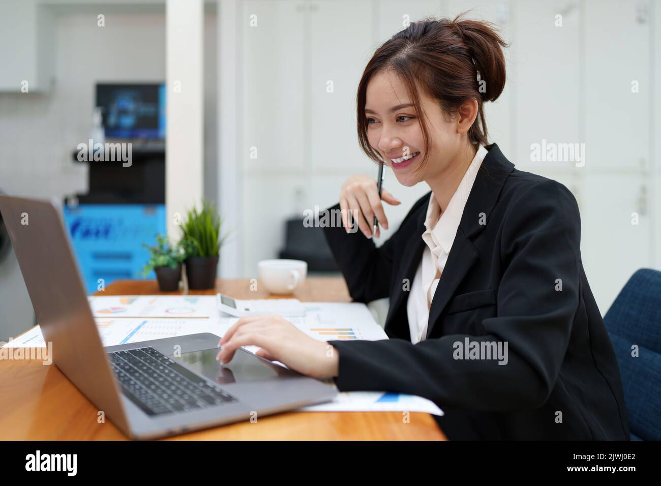 Asian woman have video call meeting with partner by laptop computer ...