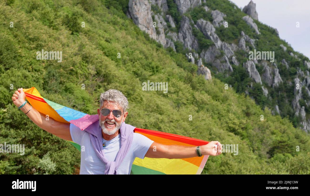 Portrait of a gray-haired senior elderly Caucasian man bisexuality with ...