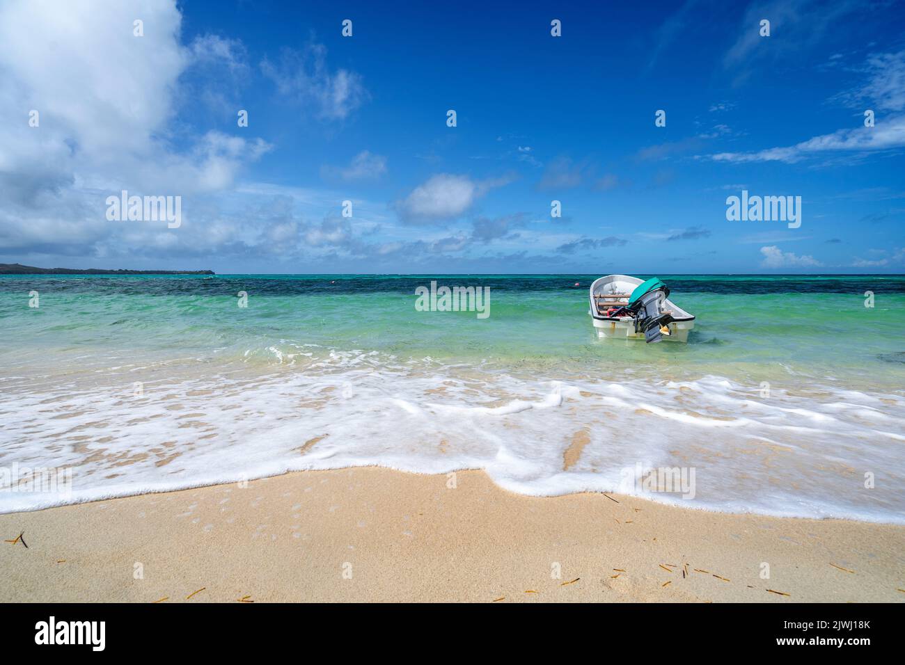 Small boat anchored of tropical sandy beach, Nanuya Lai Lai Island ...