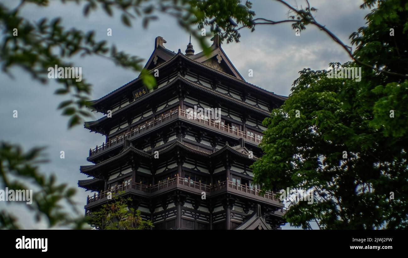 A low-angle closeup of the Dongpo Urban Wetland Park Main Building ...