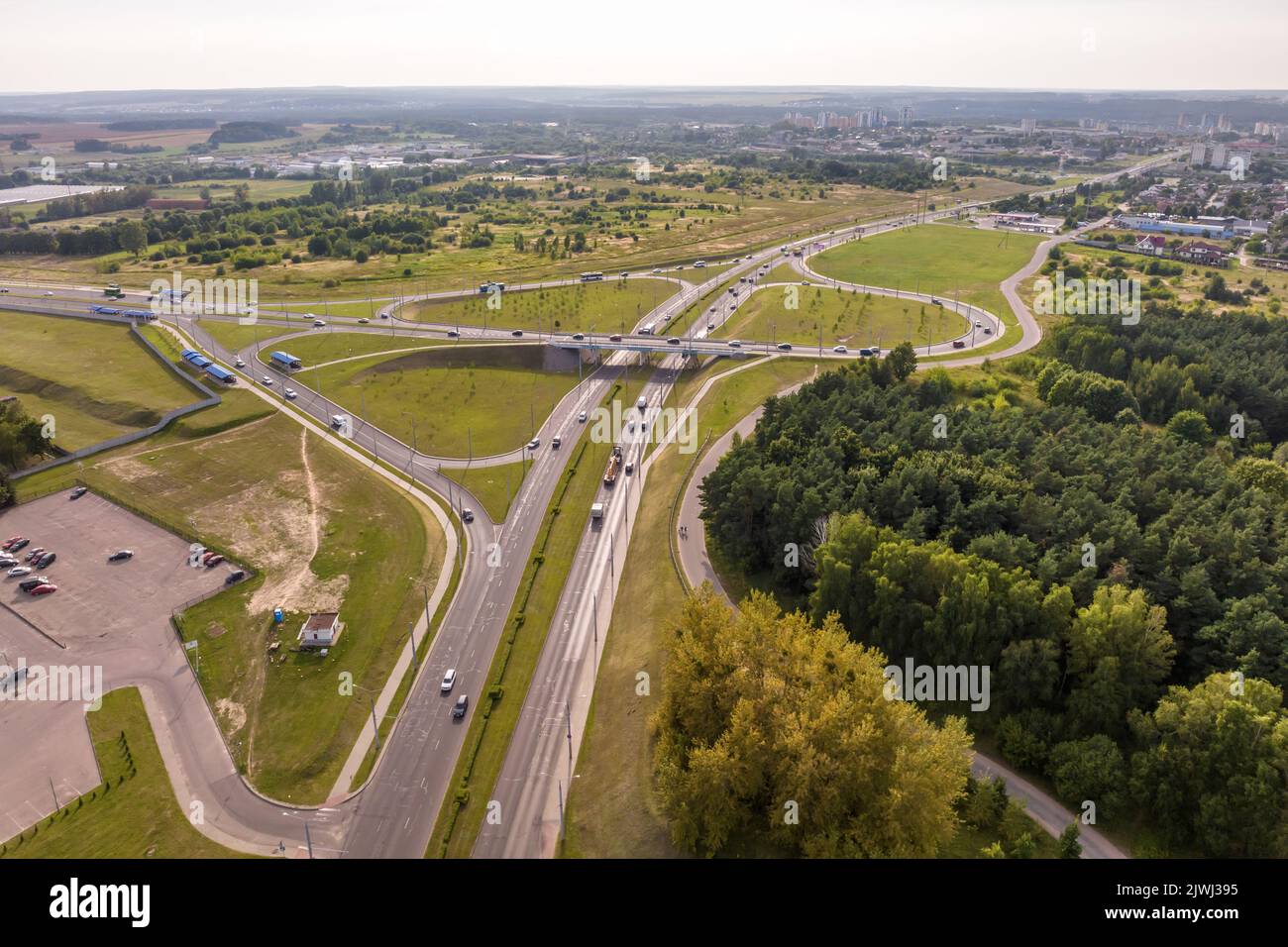aerial view of huge road junction of freeway with heavy traffic at city ...