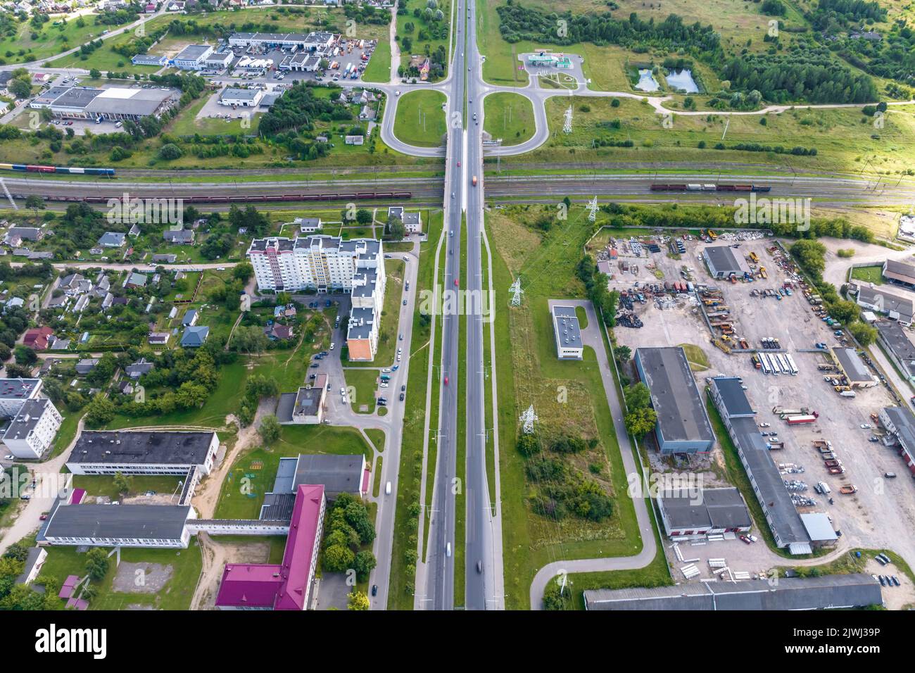 aerial view of huge road junction of freeway with heavy traffic at city ...