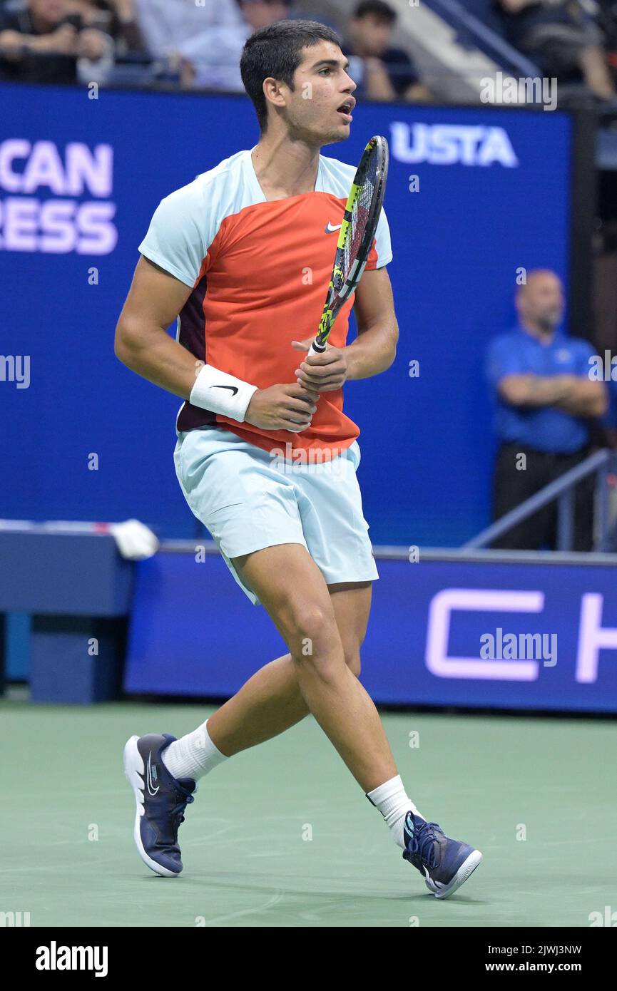 Carlos Alcaraz, of Spain, returns a shot to Marin Cilic, of Croatia ...