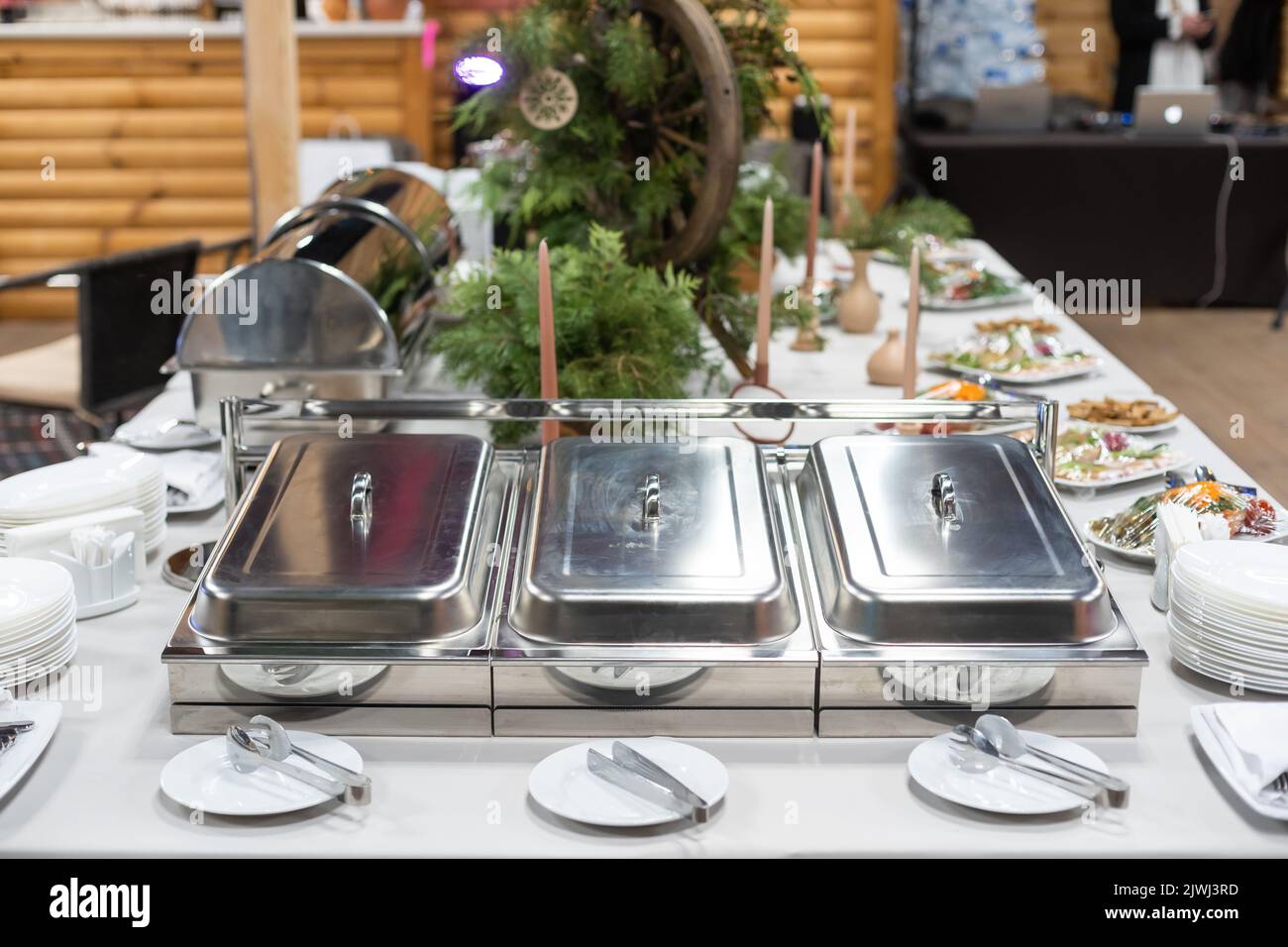 Food trays in buffet. metal containers buffet table Stock Photo - Alamy