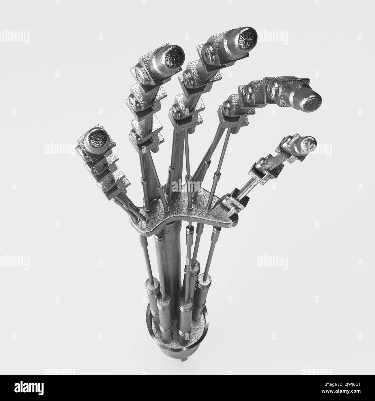 A skeleton like mechanical robotic arm made of steel on a light studio ...