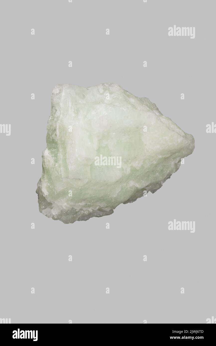 Close up white beryl stone on white background Stock Photo - Alamy