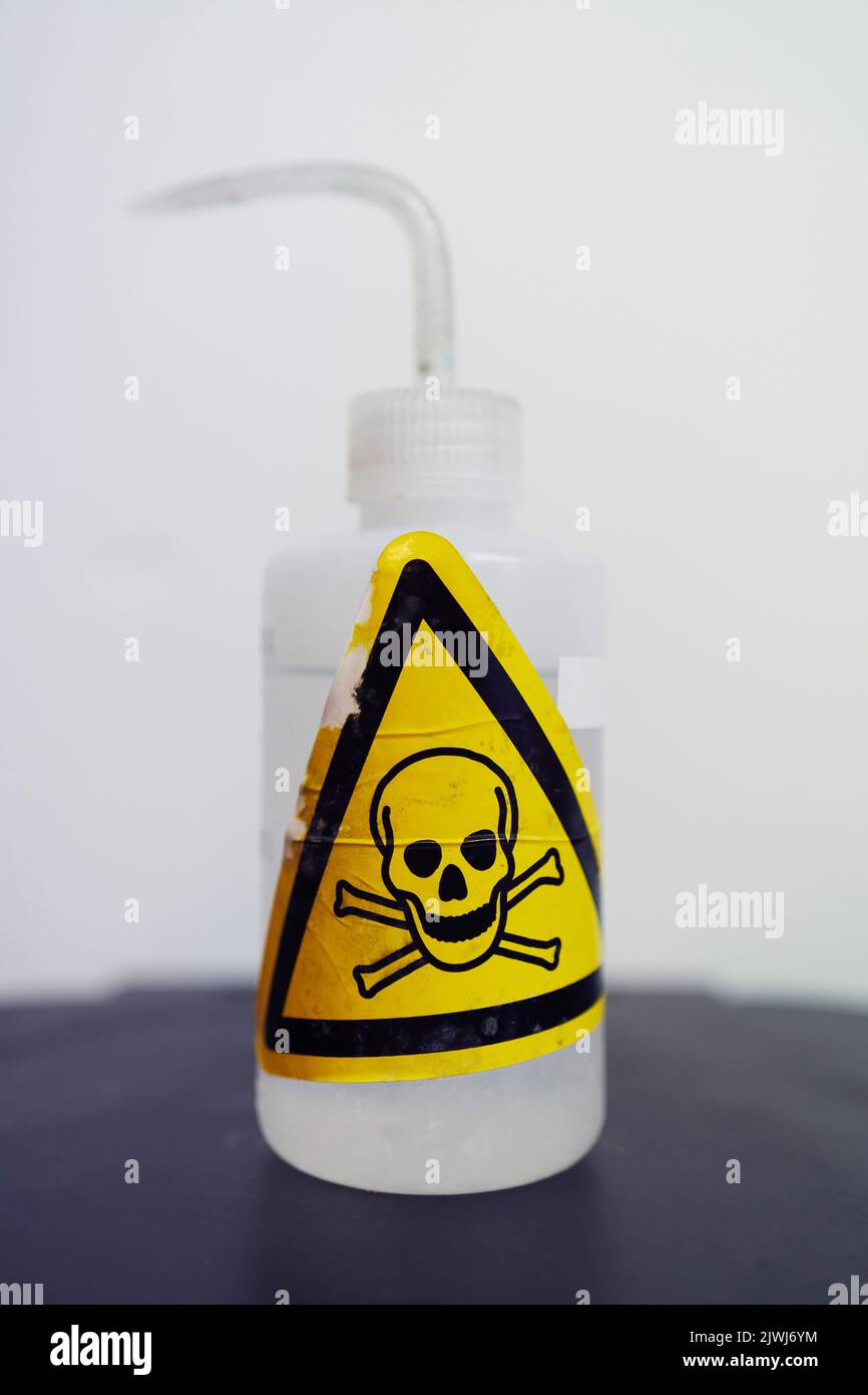 Close up biohazard label on bottle Stock Photo - Alamy