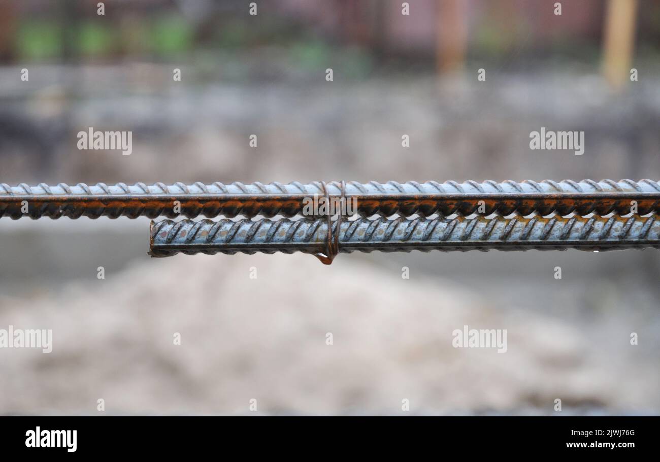 A close-up of steel reinforcement bars, iron bars with binding wires to ...