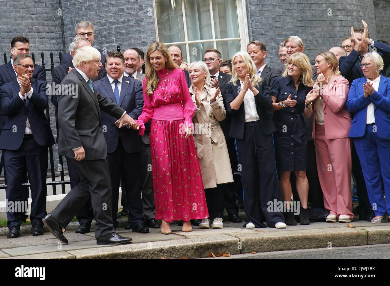 Outgoing Prime Minister Boris Johnson takes the hand of his wife Carrie ...