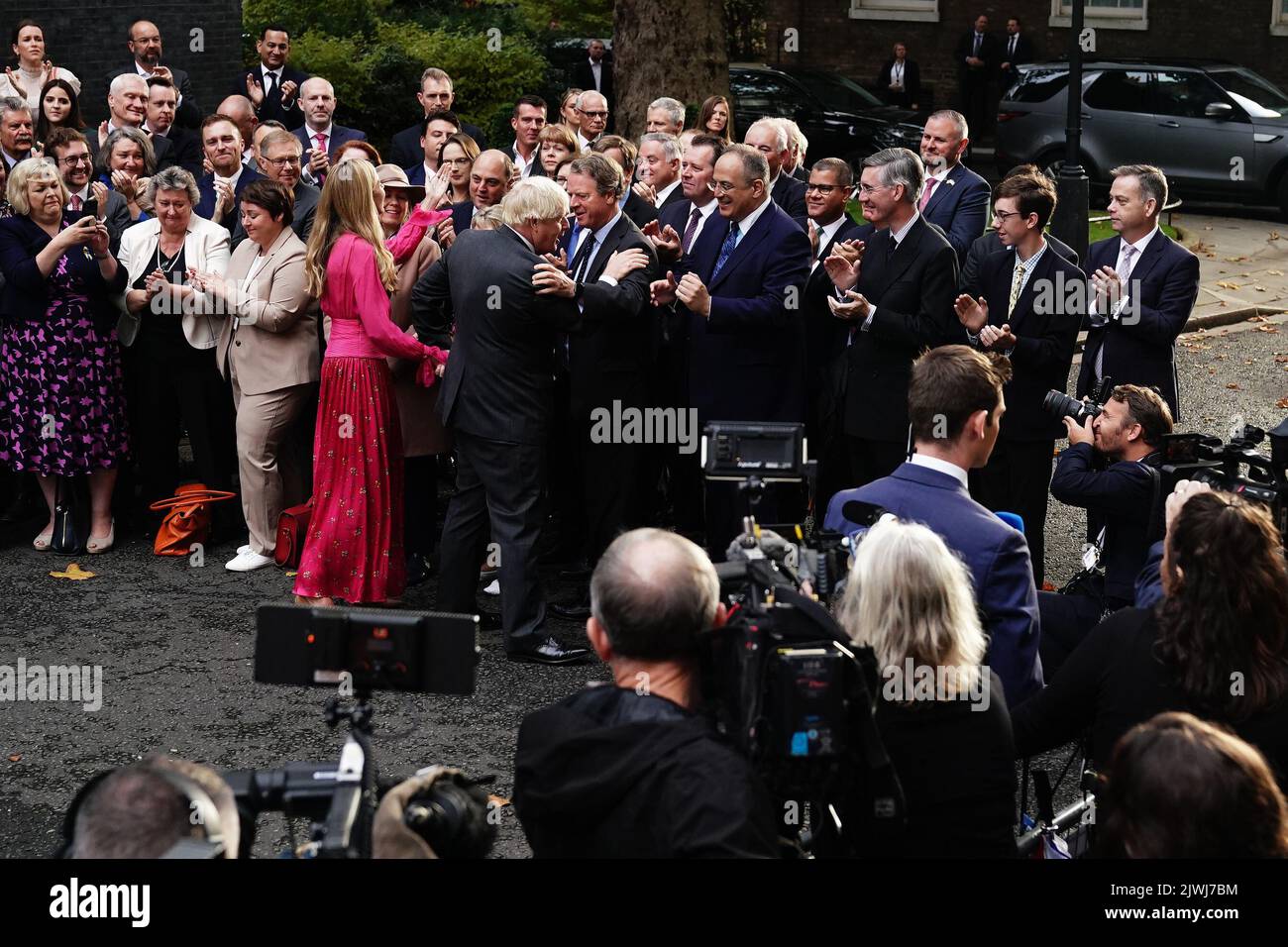 Outgoing Prime Minister Boris Johnson embraces Scottish Secretary ...