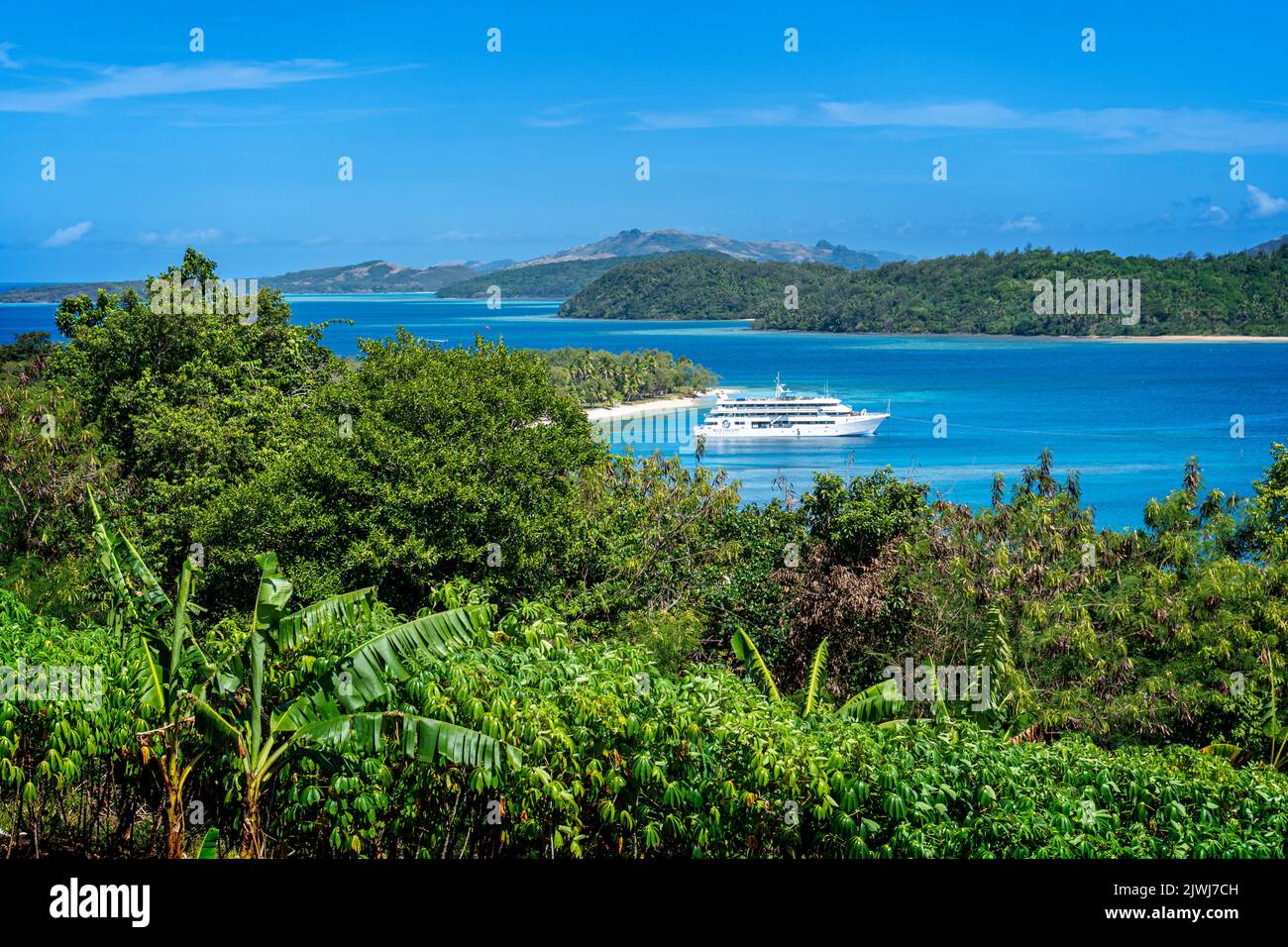 Cruise ship anchored in Blue Lagoon off Nanuya Island, Yasawa Group ...