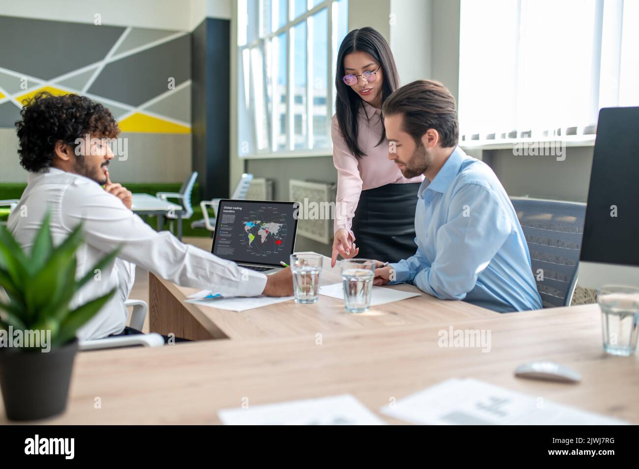 Team of professionals working together in the office Stock Photo - Alamy