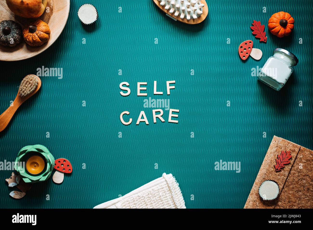 Self-care word on green background flat lay. Self-care text wooden ...