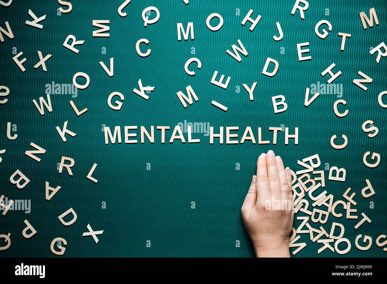 Mental health word from wooden letters. Mental health text on green ...