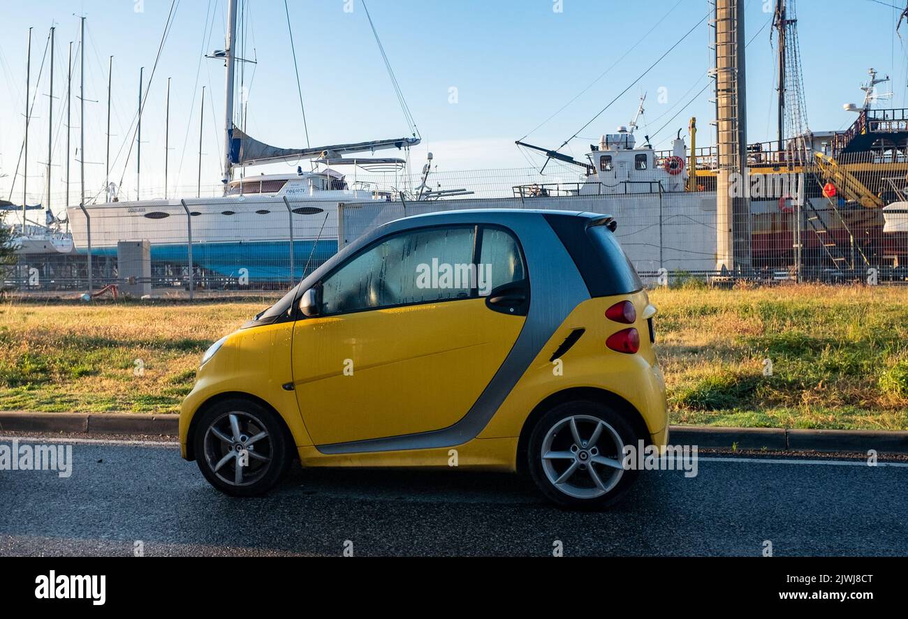 December 10, 2021, Sochi, Russia. Yellow Smart Fortwo car in the port ...