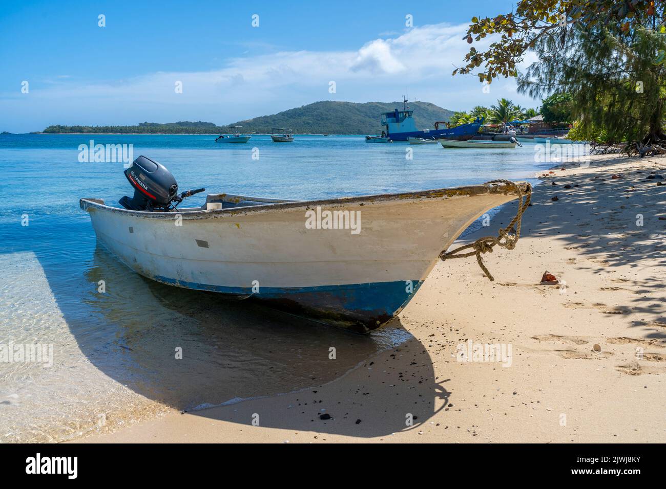 Small boat used by locals for inter-island transport on beach at Nanuya ...