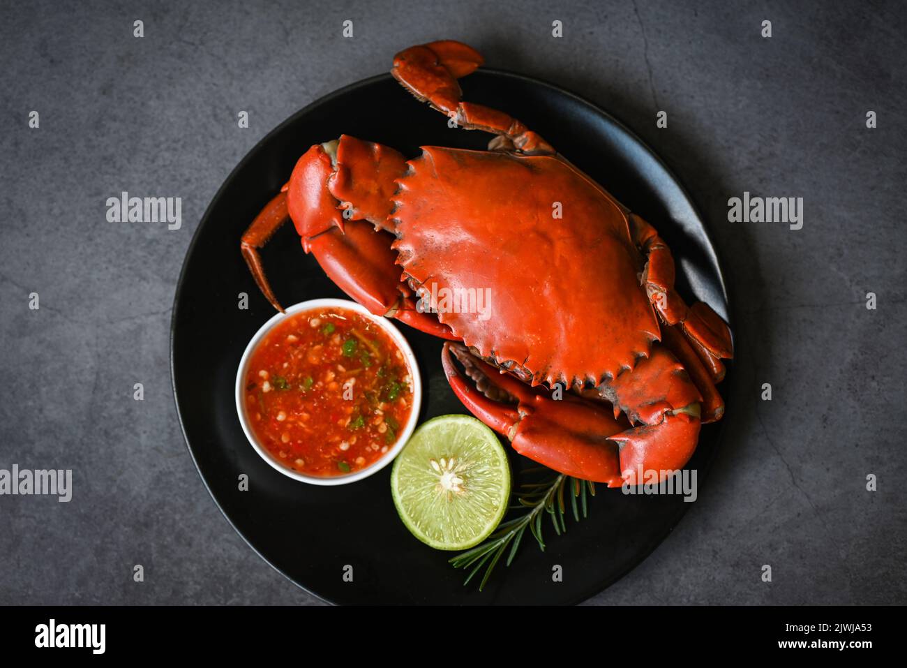 crab seafood plate with, fresh crab on black plate, crab cooking food ...