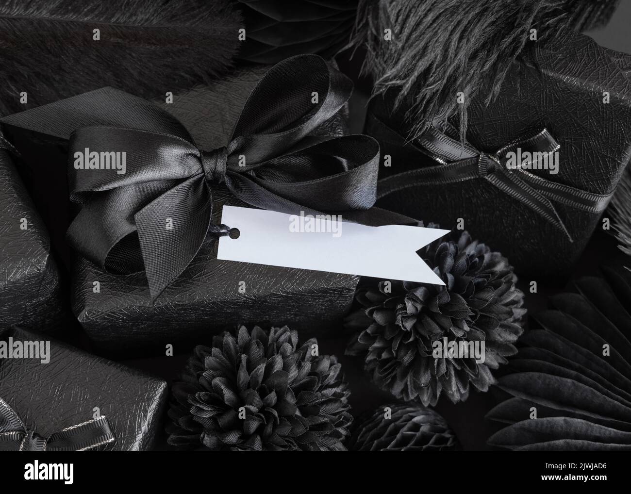 Wrapped Gift Boxes with black paper flowers and decorations and ...
