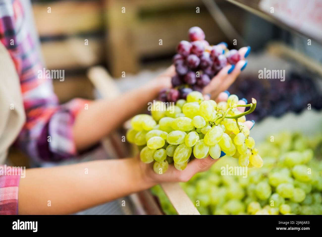 Woman examining food fridge hi-res stock photography and images - Alamy