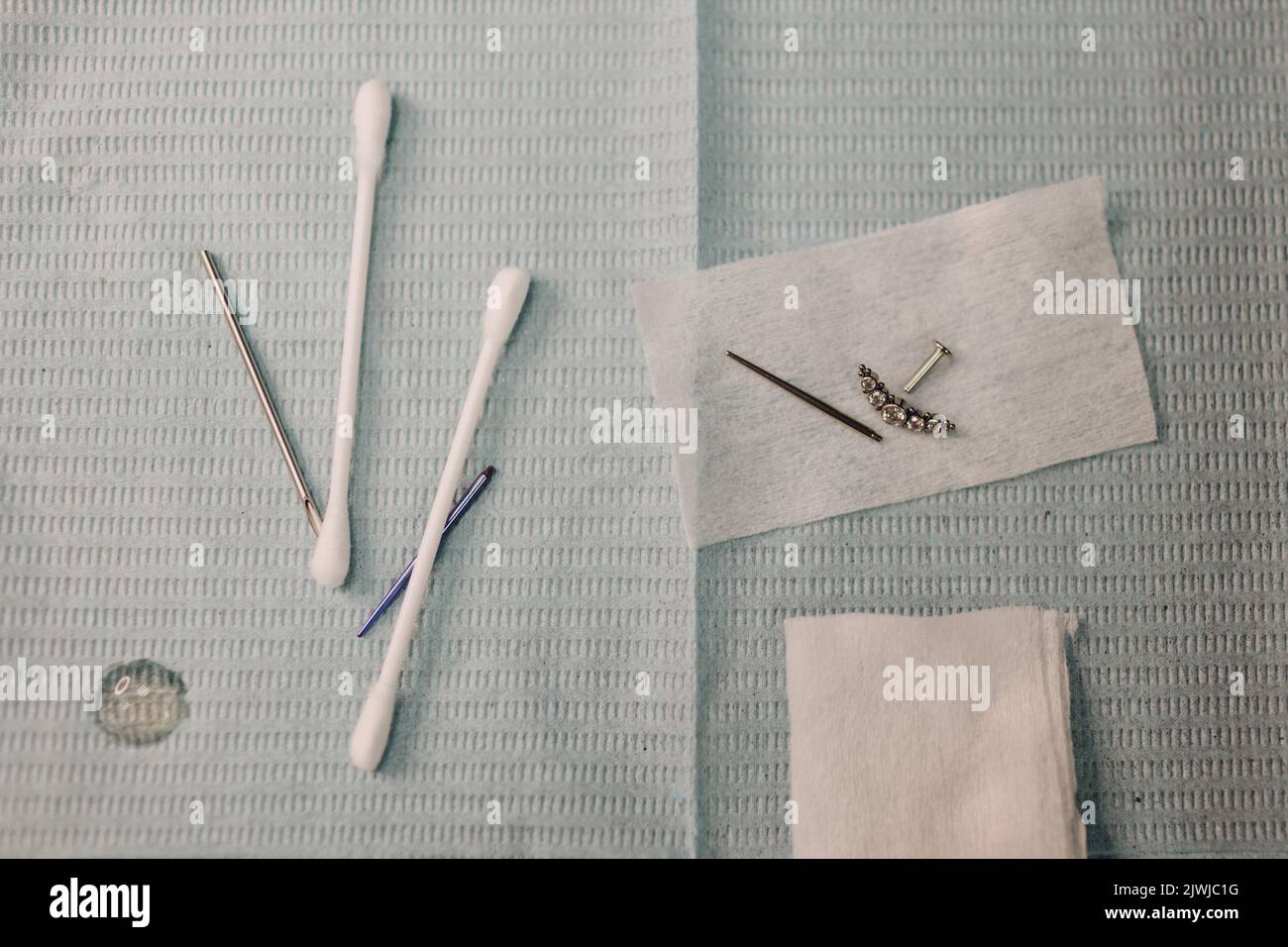 Body piercing procedure hi-res stock photography and images - Alamy