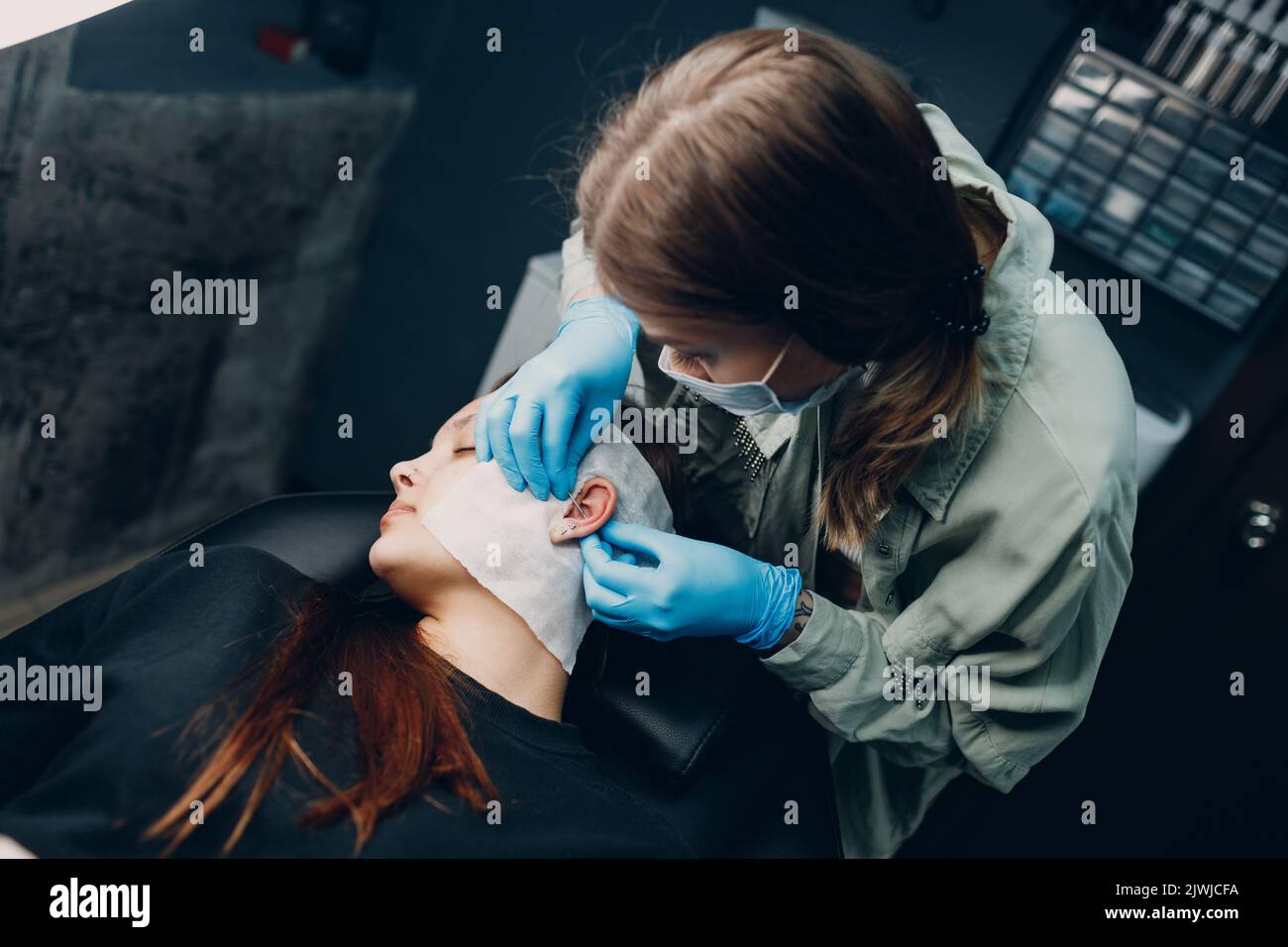 Body piercing procedure hi-res stock photography and images - Alamy