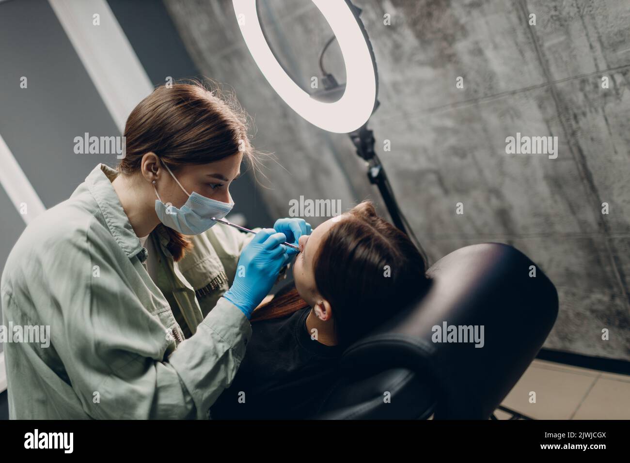 Body piercing procedure hi-res stock photography and images - Alamy