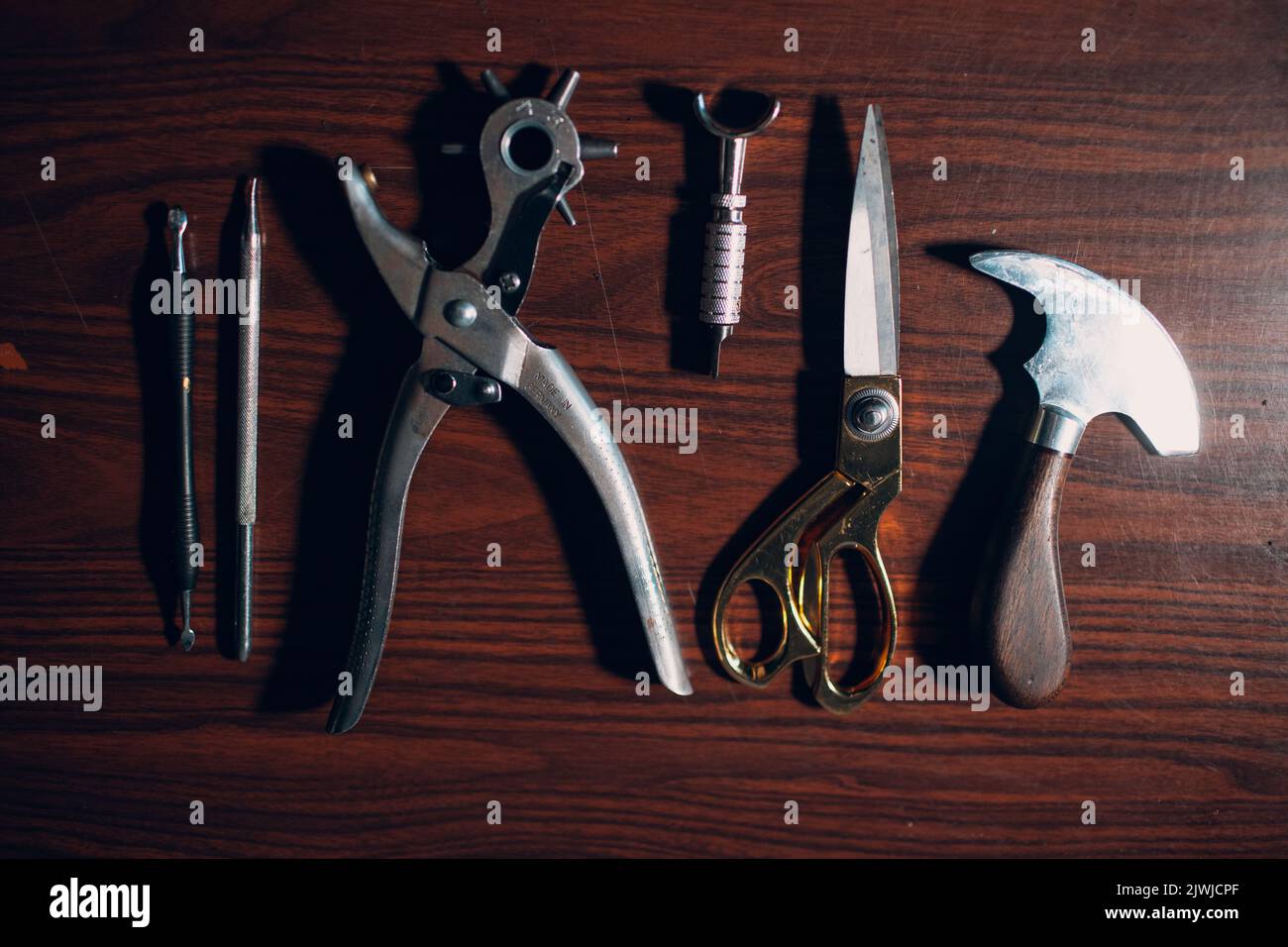 Tanner tools for leather goods on workshop. Working process of leather ...