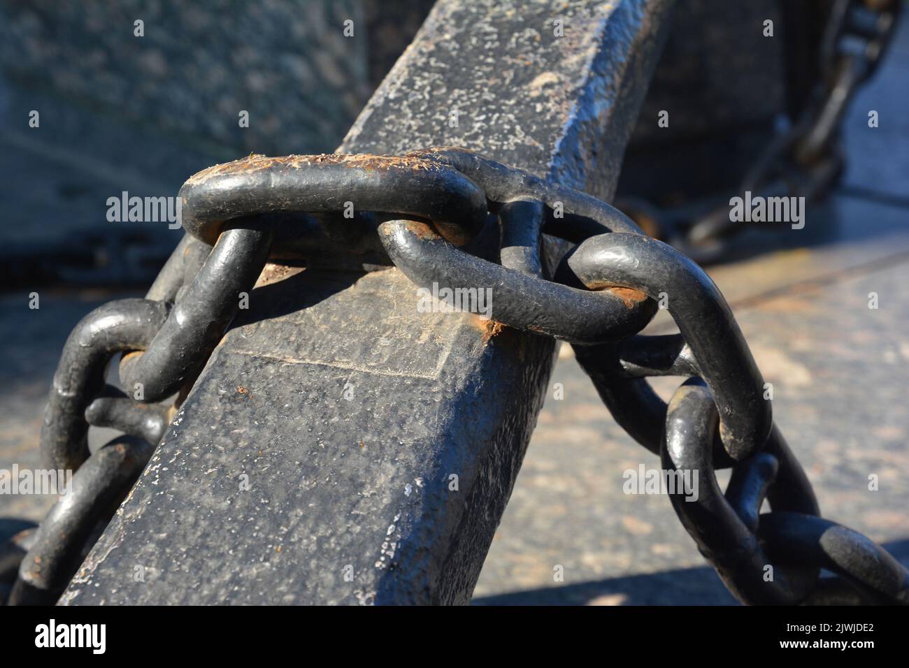 A close-up of a large metal chain as a concept of restriction of ...