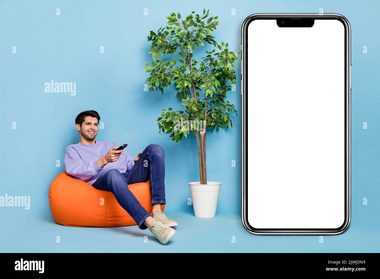 Photo of guy enjoy free time sit bean chair poster watch series ...