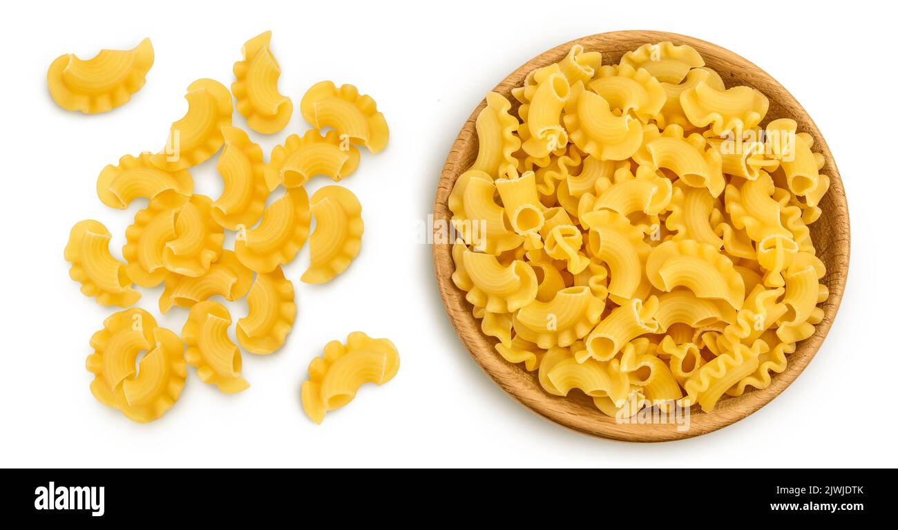 Pasta cornetti creste macaroni in wooden bowl isolated on white ...