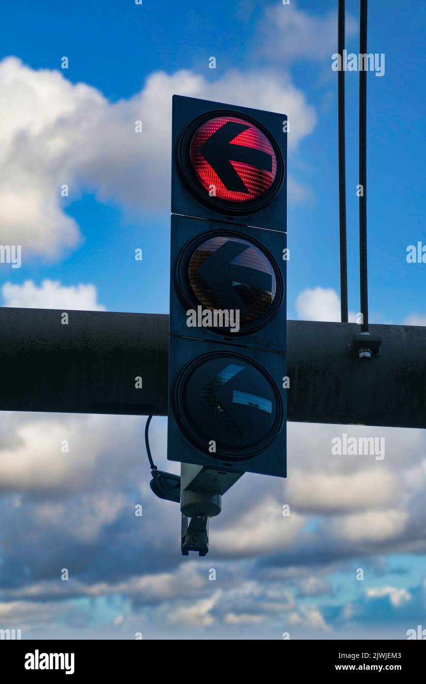 The traffic lights with arrow on horizontal pole Stock Photo - Alamy