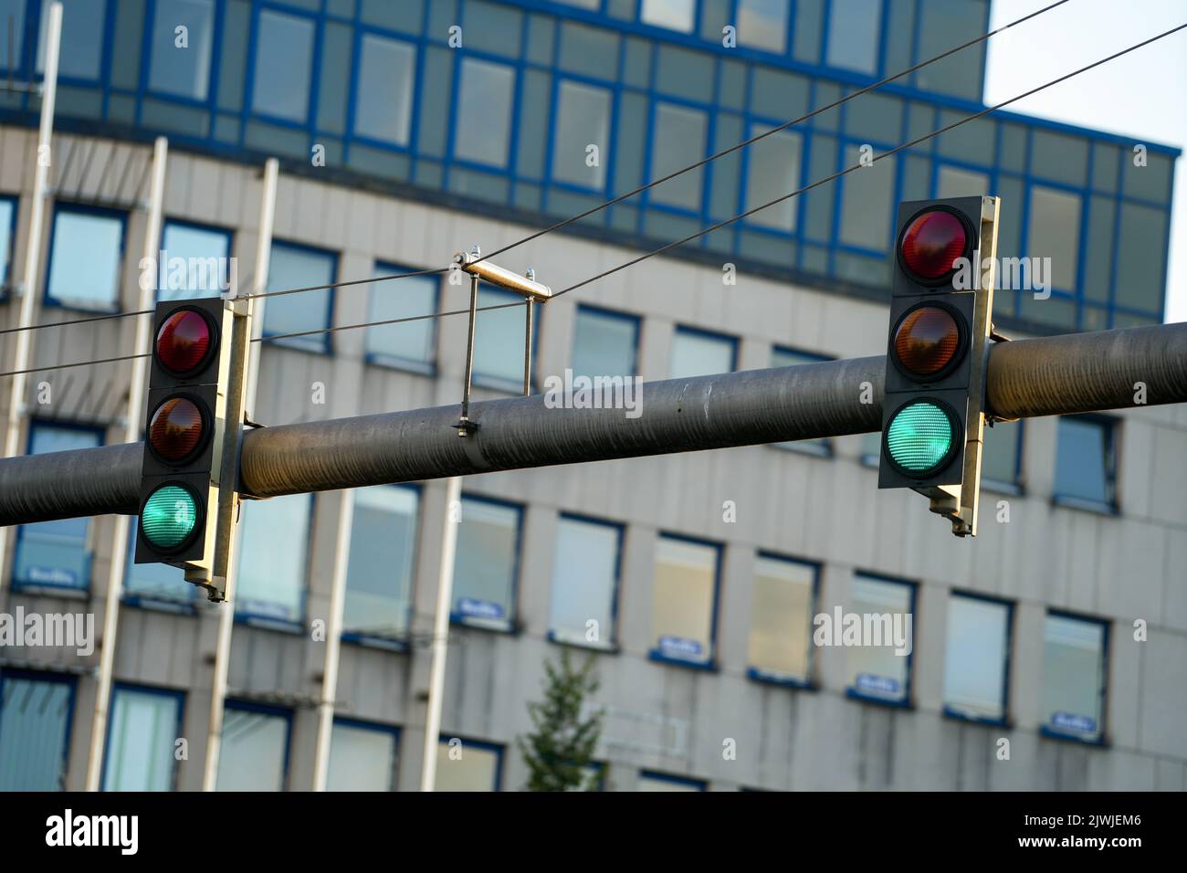 The traffic lights with green light on horizontal pole Stock Photo - Alamy