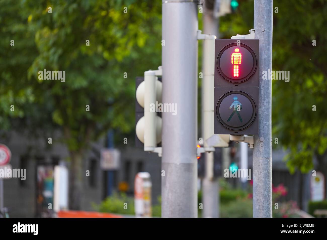 The pedestrian traffic lights with the red light on vertical pole Stock ...