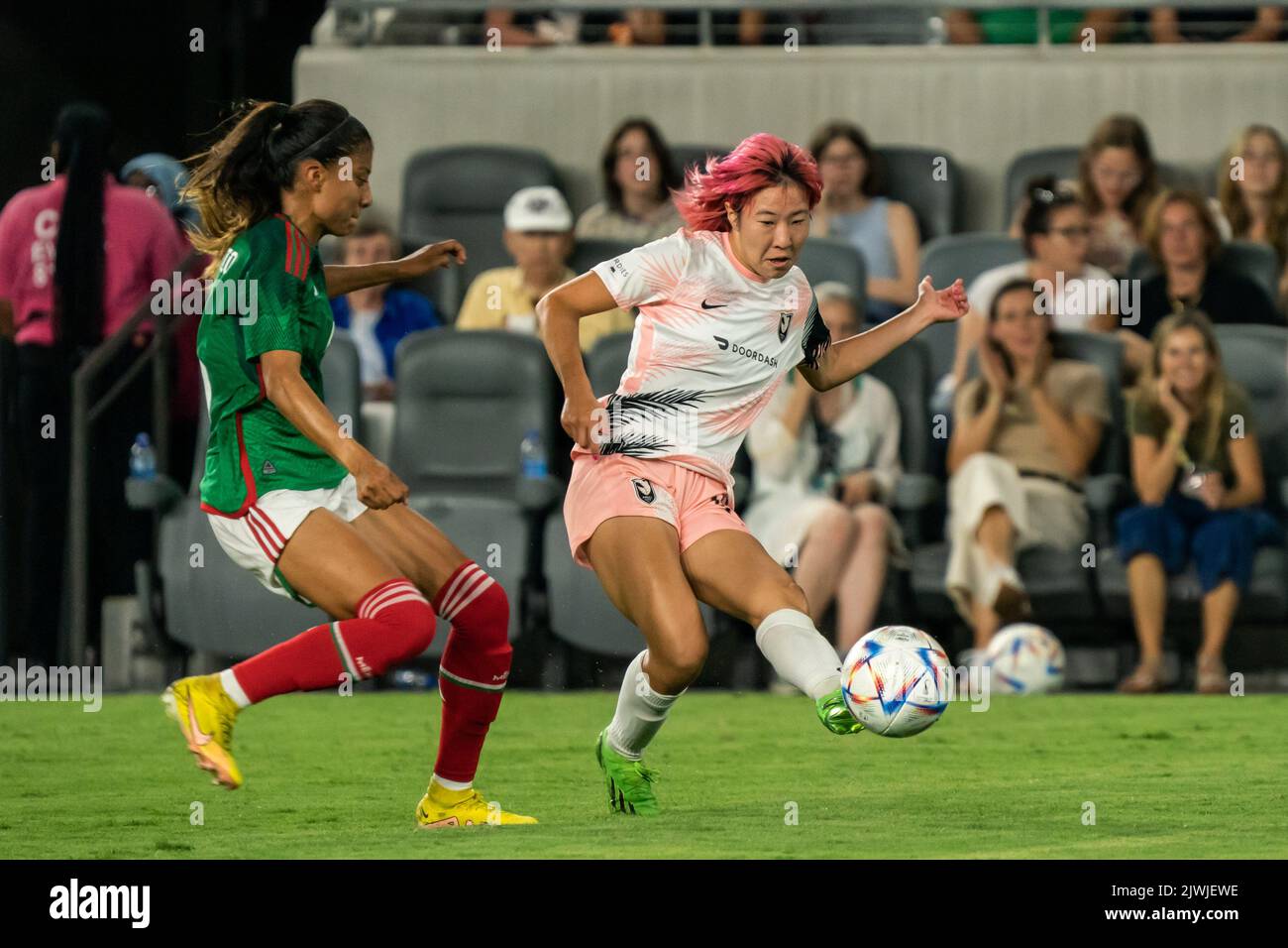 Angel City FC forward Jun Endo (18) makes a pass as Mexico midfielder ...