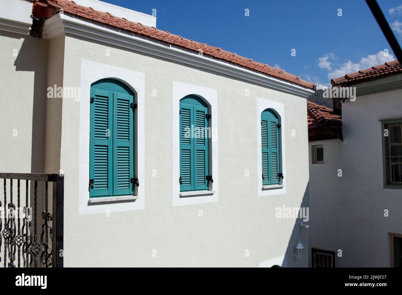 Building exterior with turquoise shutters hi-res stock photography and ...