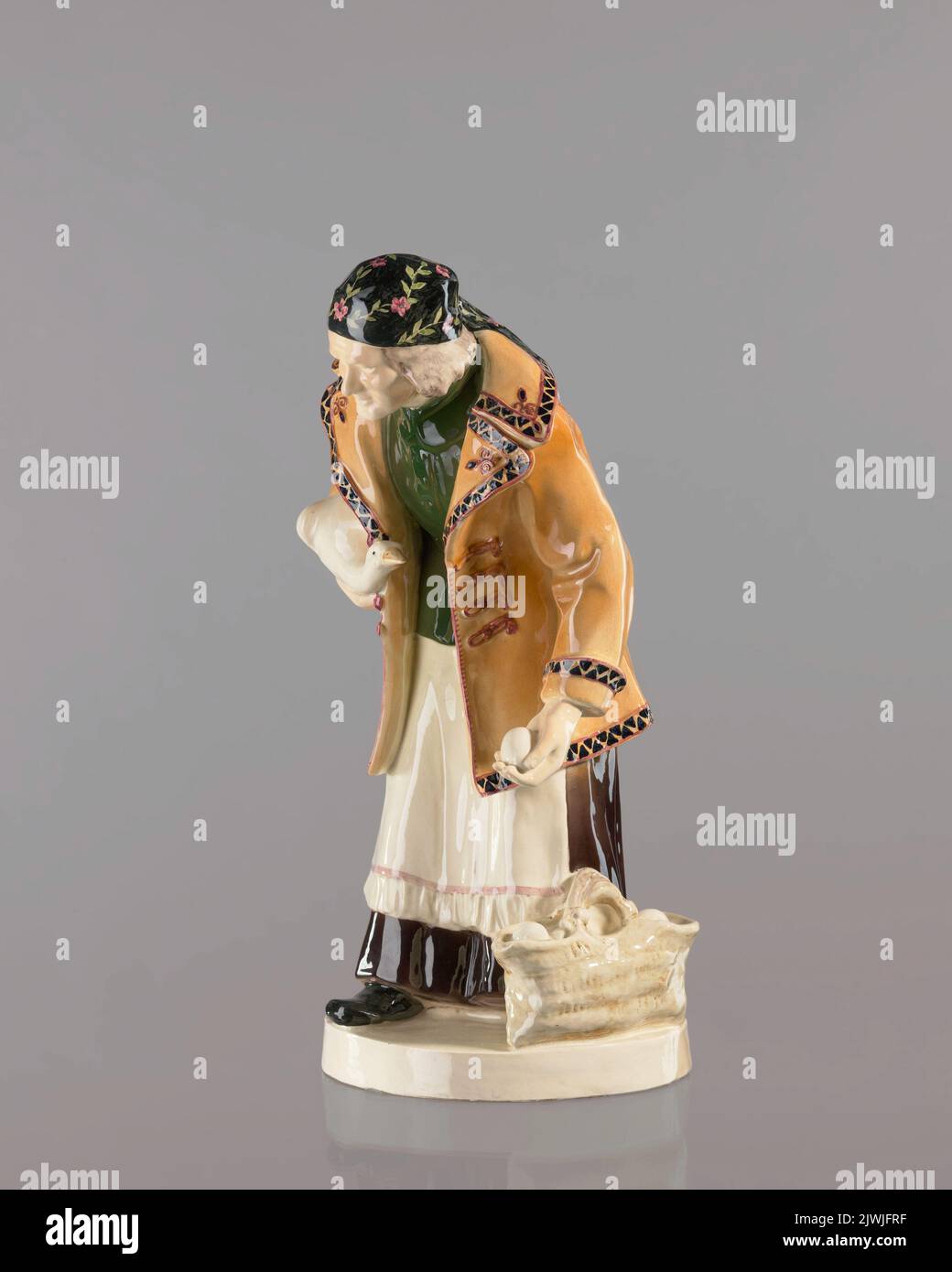Figure of a farmer's wife with a goose and basket. Fabryka fajansów ...