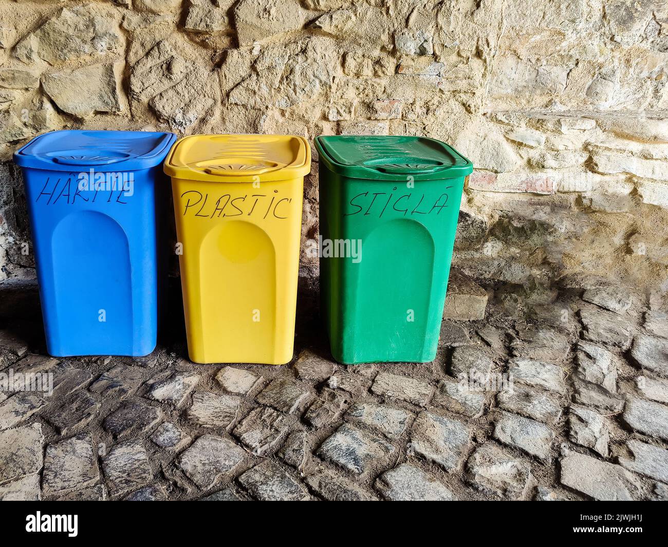 Multi-colored plastic containers for separate garbage collection. The ...