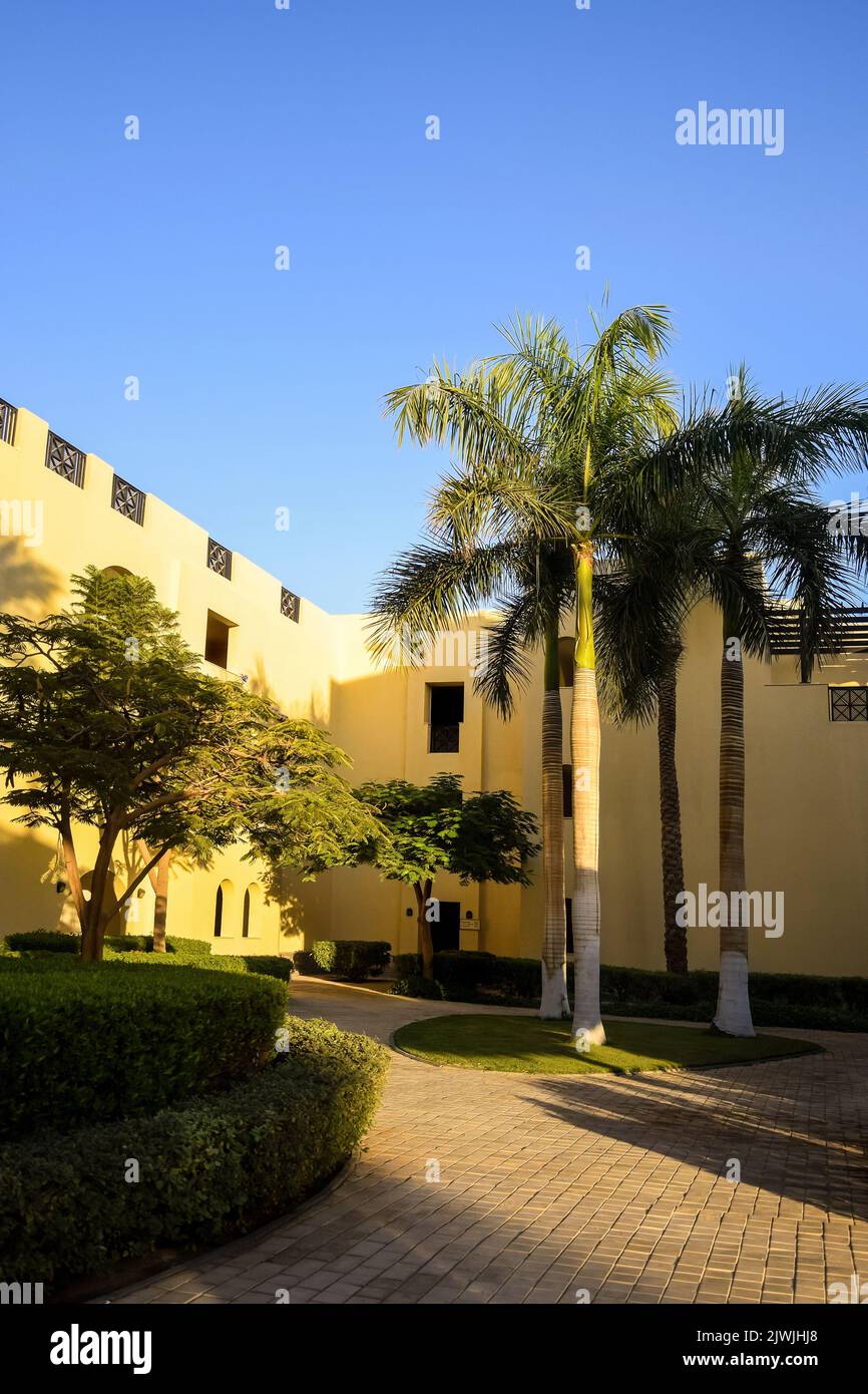 Architecture of buildings is in Arabic style. An arch windows in wall ...