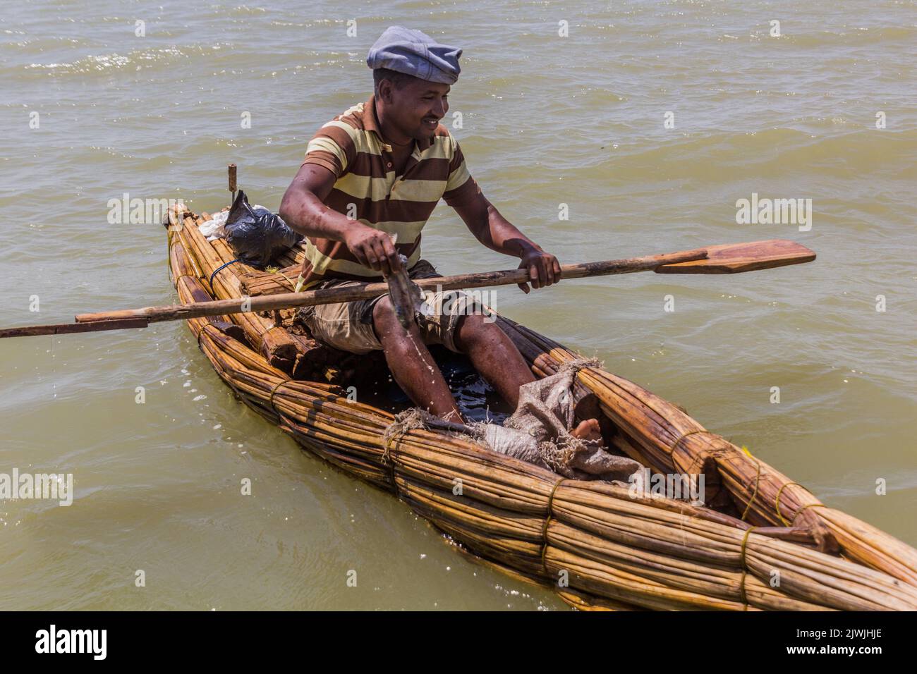 TANA, ETHIOPIA - APRIL 1, 2019: Local fisherman on a small boat at Tana ...