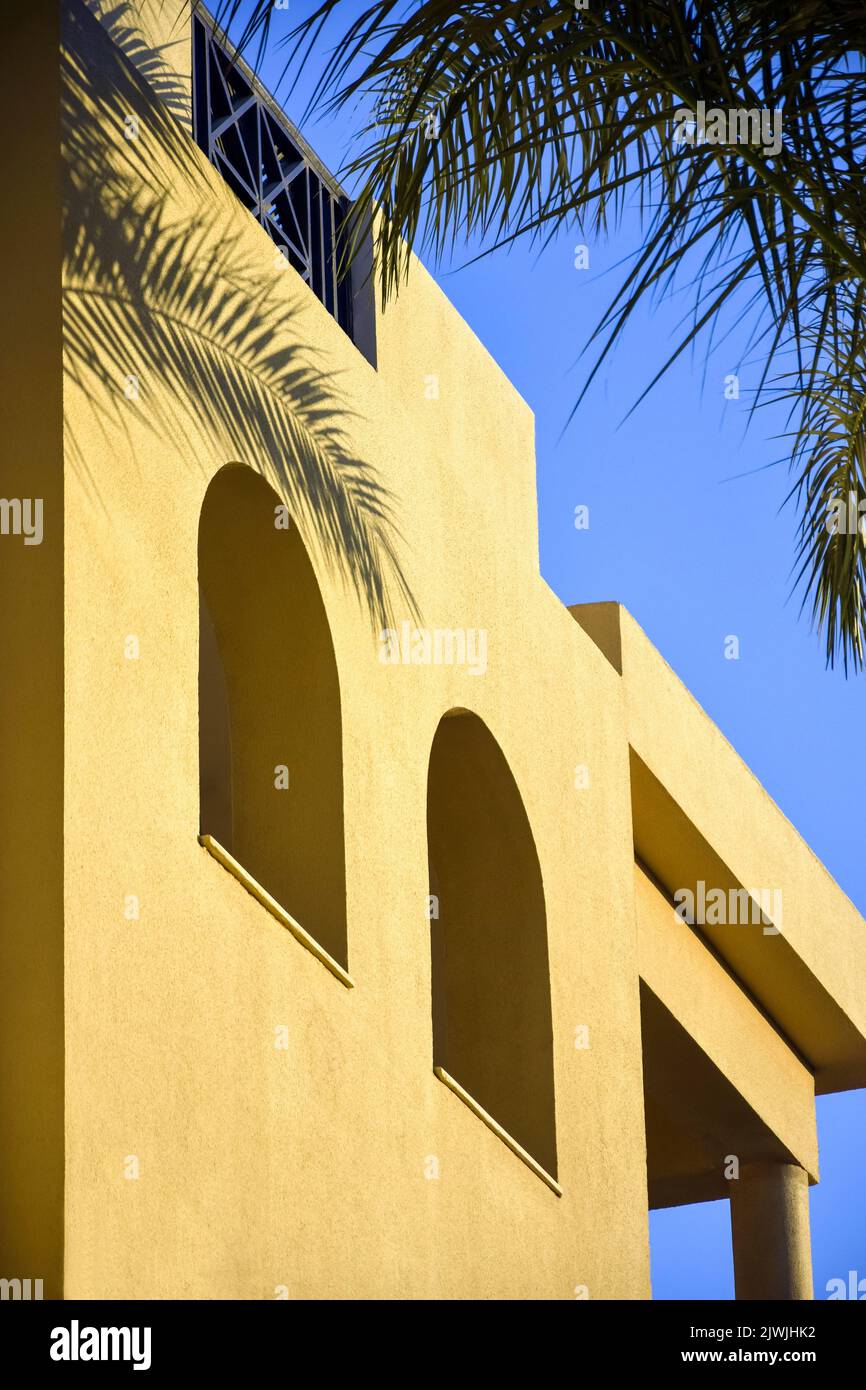 Architecture of buildings is in Arabic style. An arch windows in wall ...